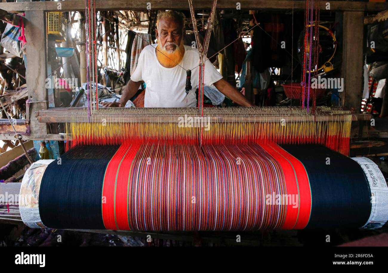 Hand of Hispanic man weaving fabric on loom Stock Photo - Alamy