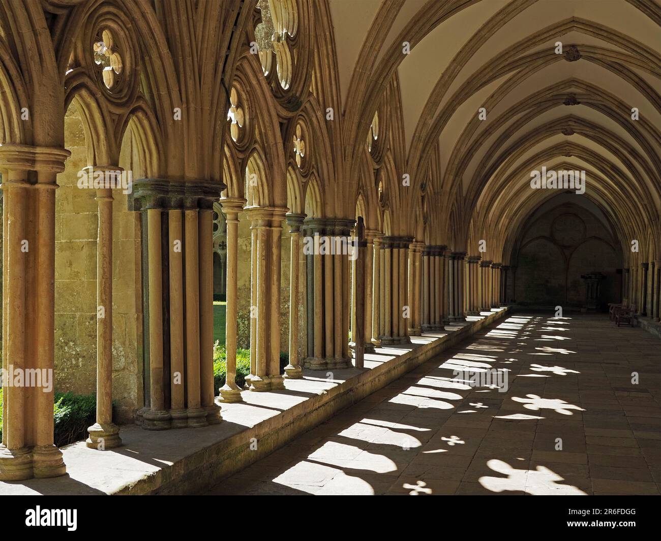 ancient pattern of light and shadows cast by sunshine through arches in ...