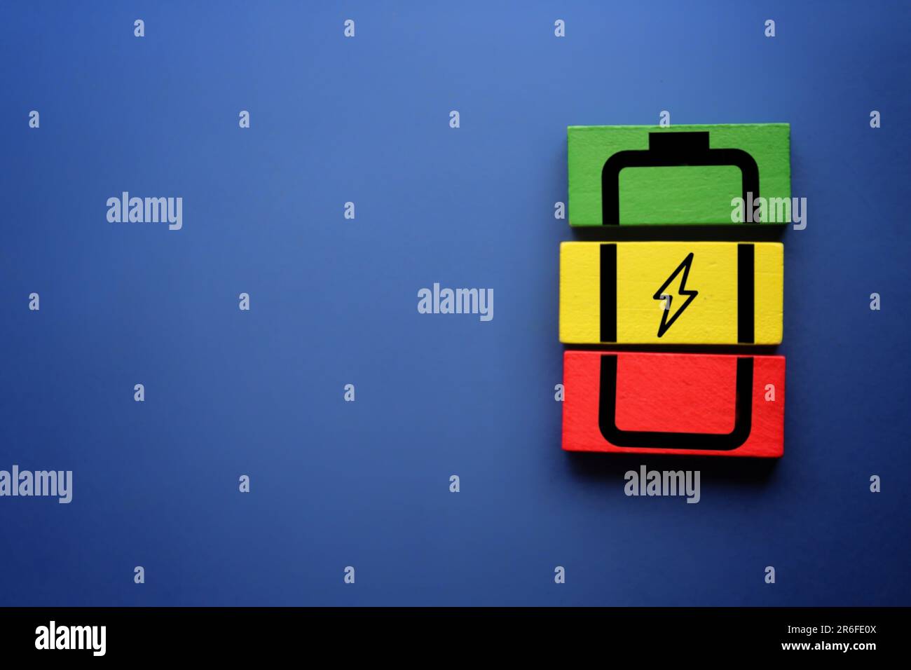 Wooden cubes with battery icon. Copy space for text. Mental health ...