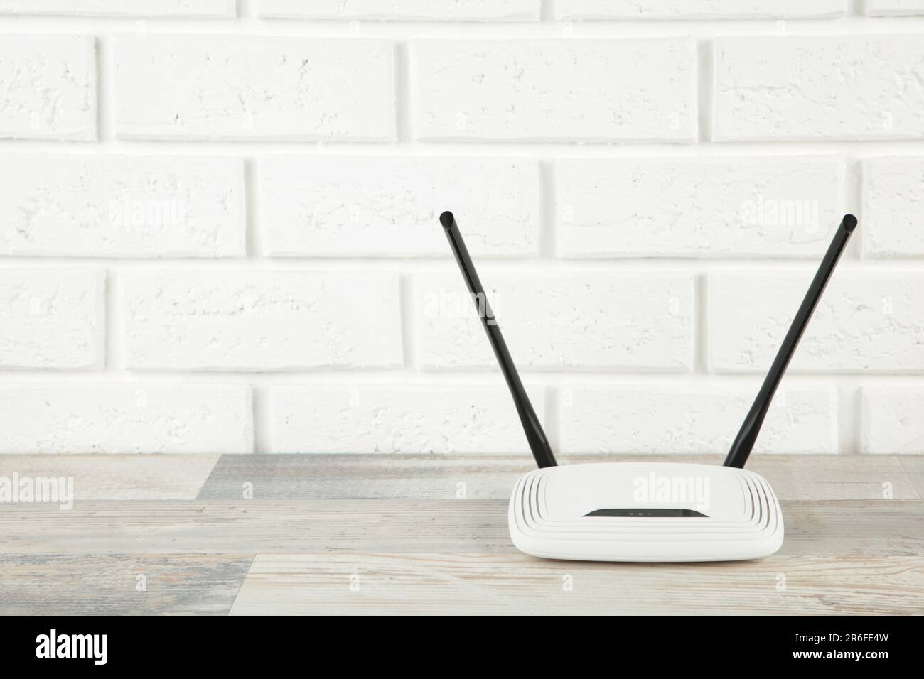Wireless Wi-Fi router on white background. Top view Stock Photo - Alamy