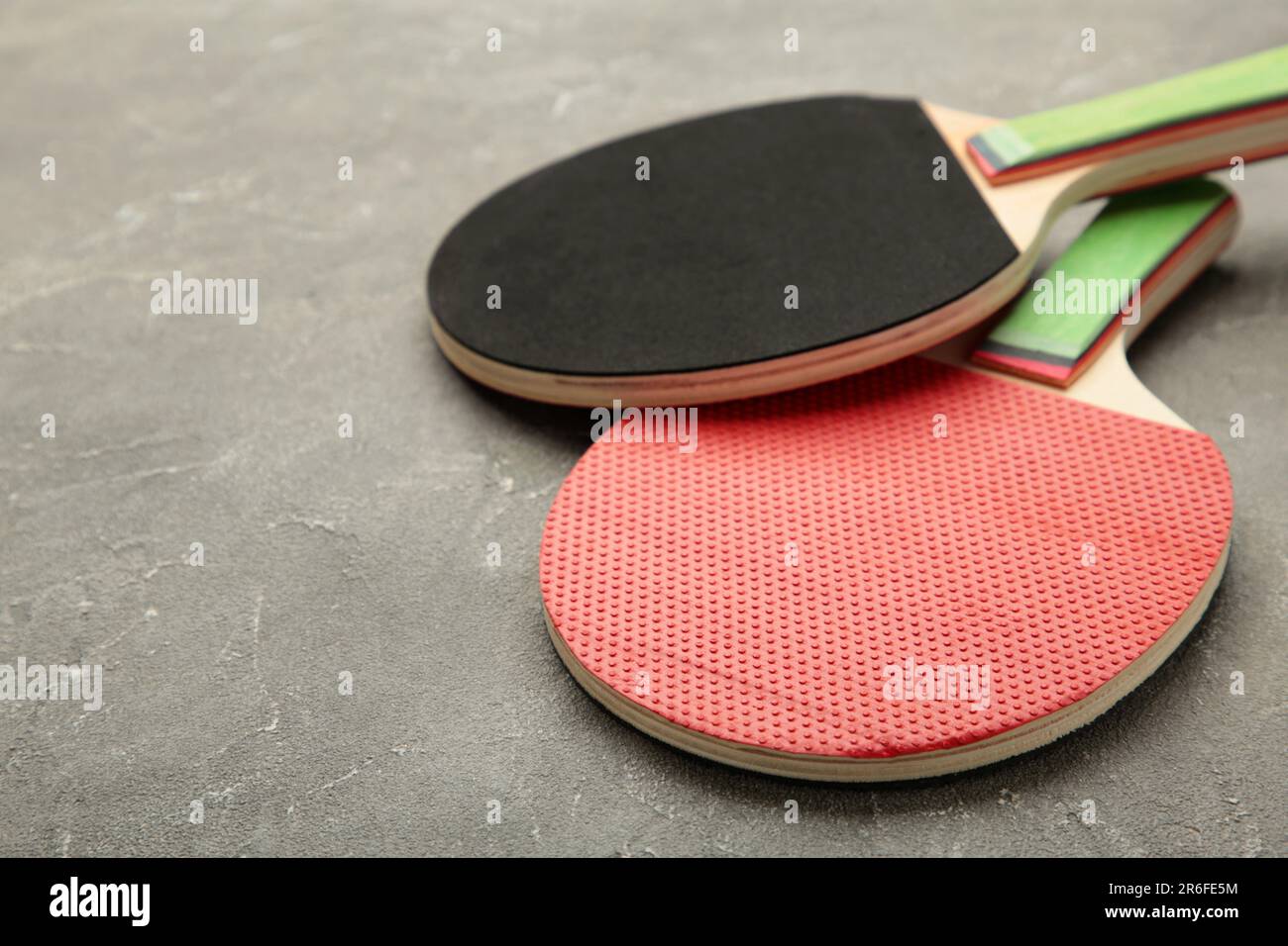 Ping pong paddles on grey with copy space. Table tennis racket. Top ...