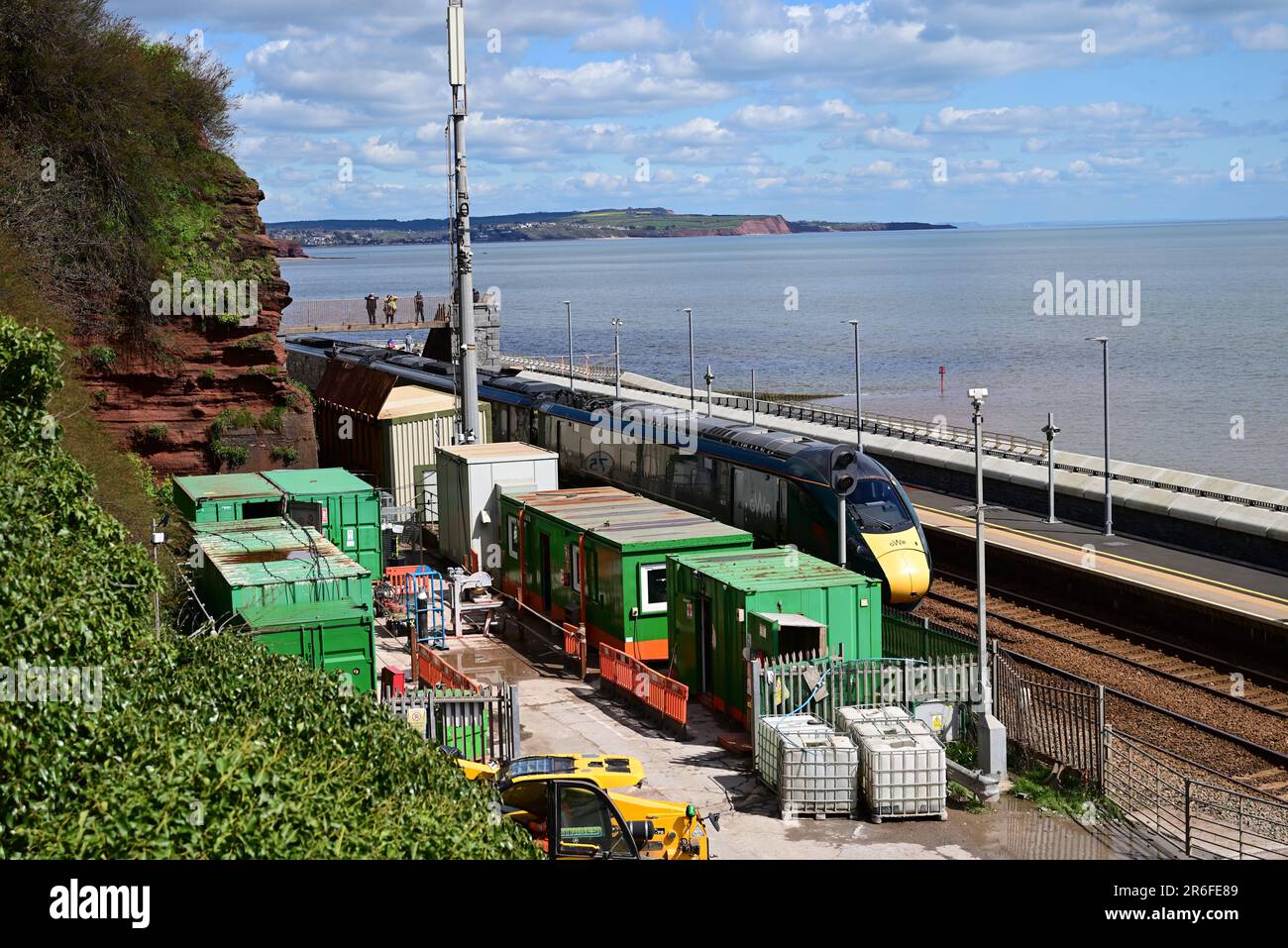 A train passing through Dawlish station during building works to ...