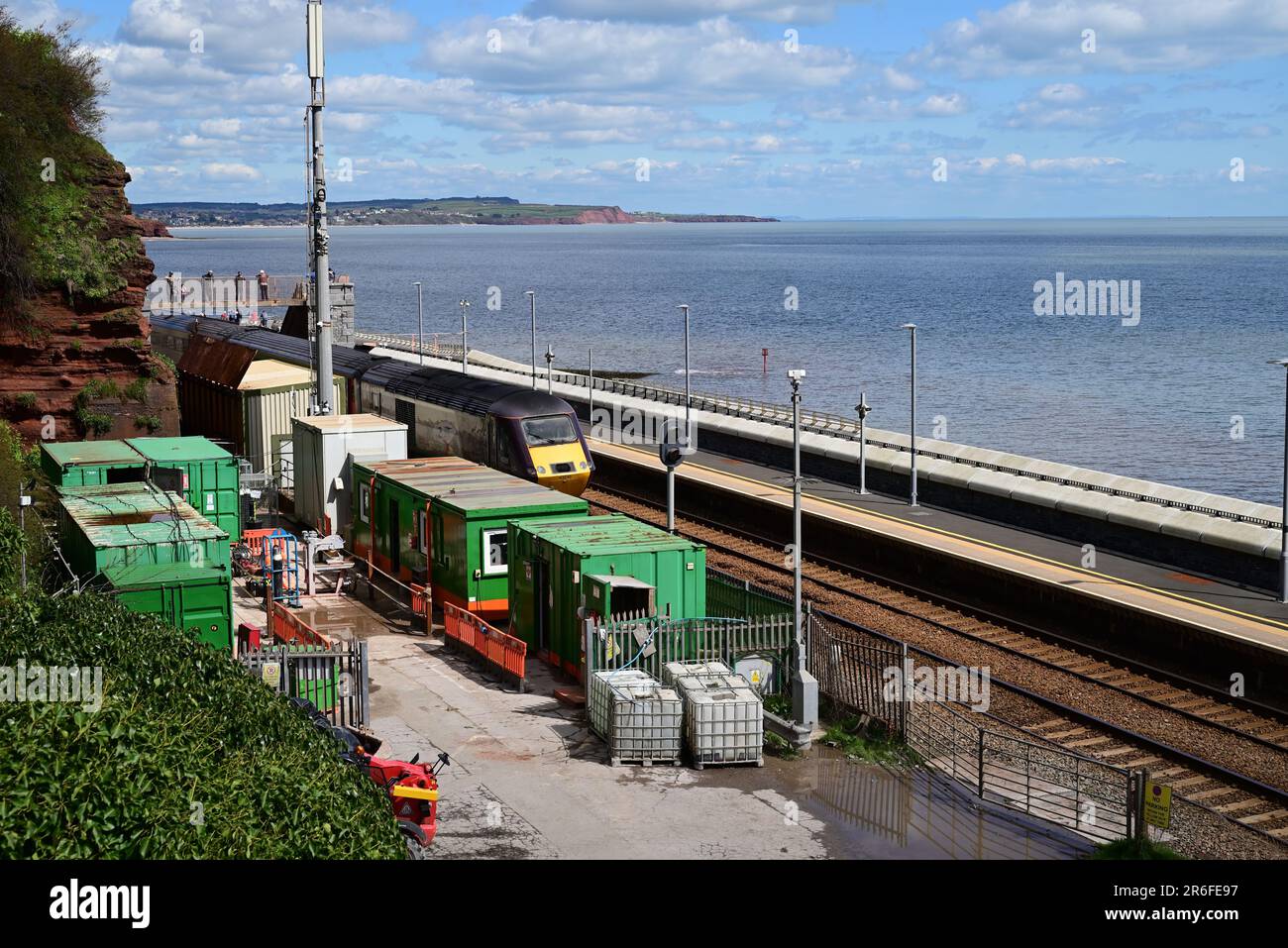 A high speed train passing through Dawlish station during building ...