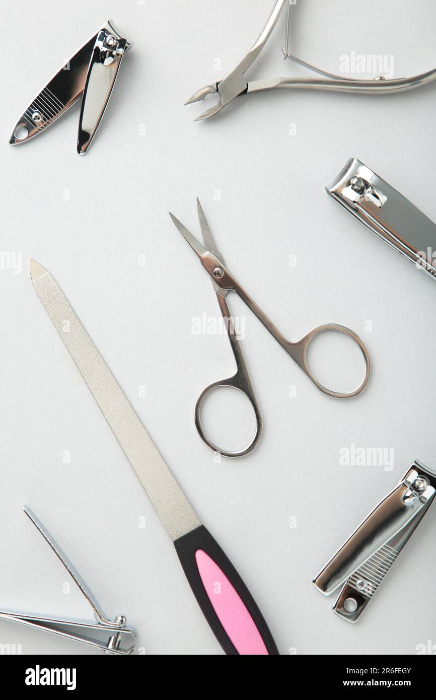 Tools of a manicure set on grey background. Top view Stock Photo - Alamy