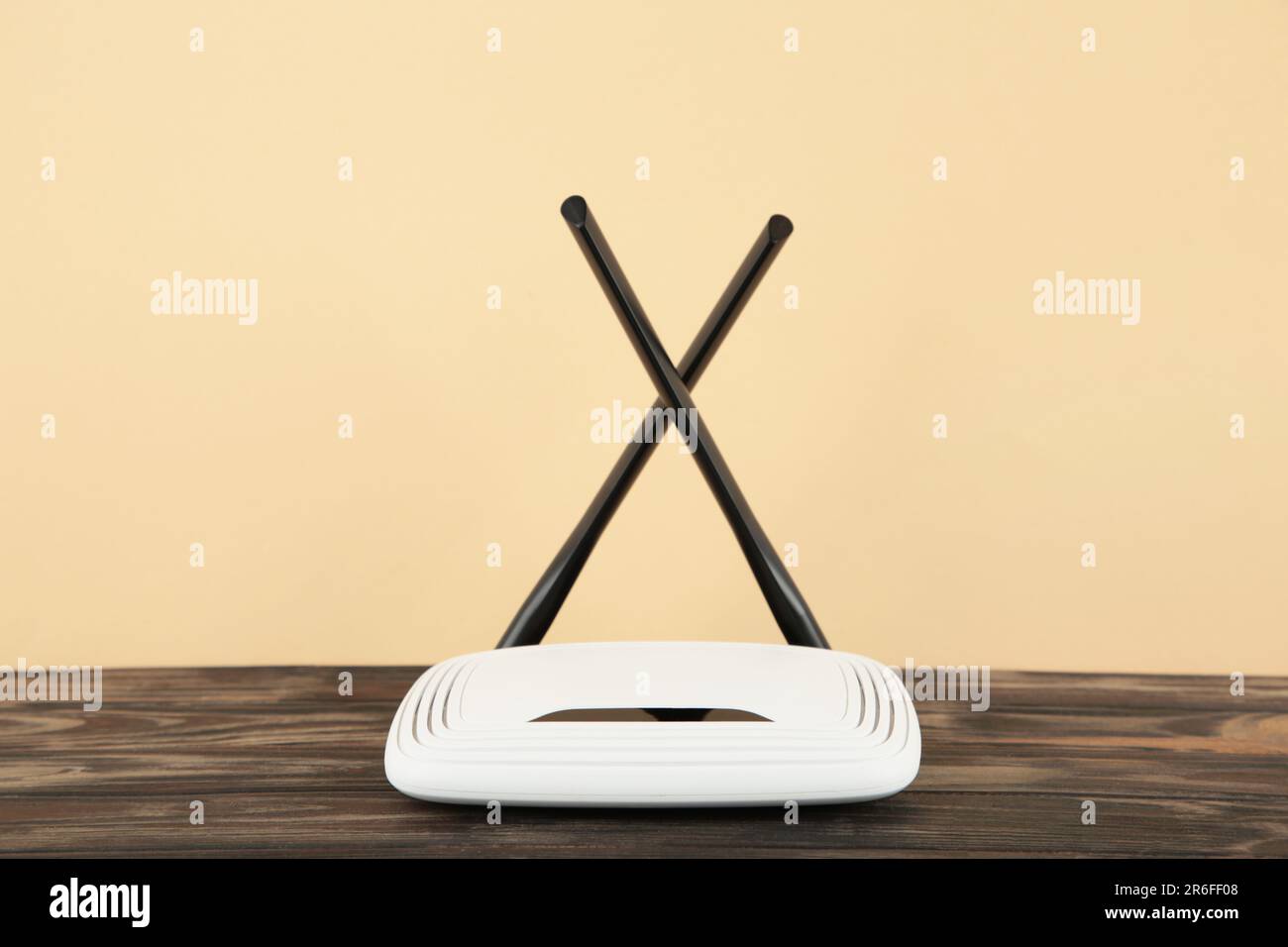 Wireless Wi-Fi router on brown background. Top view Stock Photo - Alamy