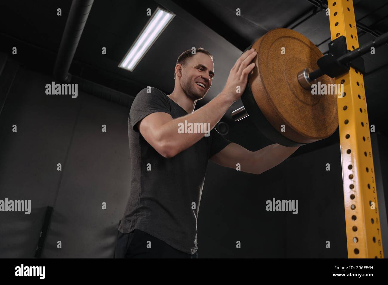 Portrait happy man lift heavy hi-res stock photography and images - Alamy