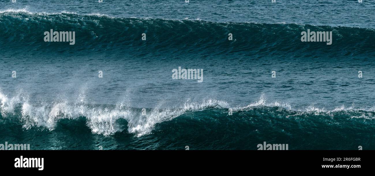 A panoramic view of waves breaking in Fistral Bay in Newquay in ...