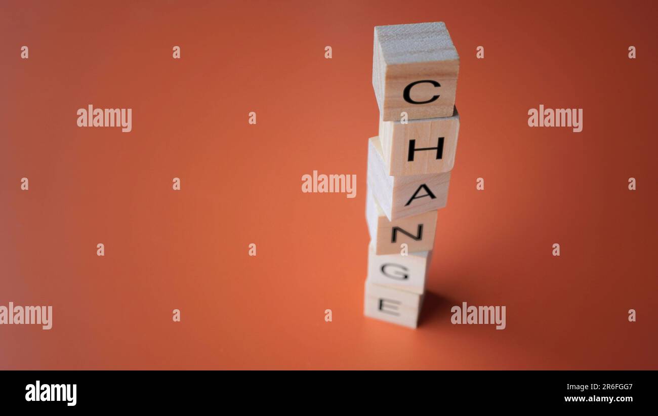 Wooden cubes with text CHANGE. Copy space for text. Adapting to change ...