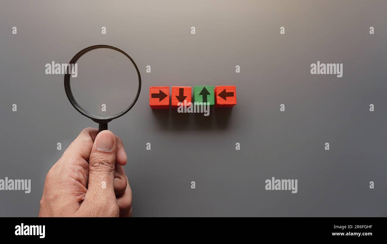 Magnifying glass and arrow. Looking for a right direction, moving ...