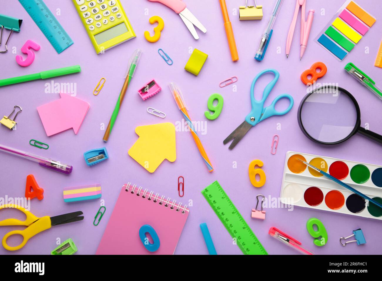 School supplies on purple background. Back to school concept. Top view ...