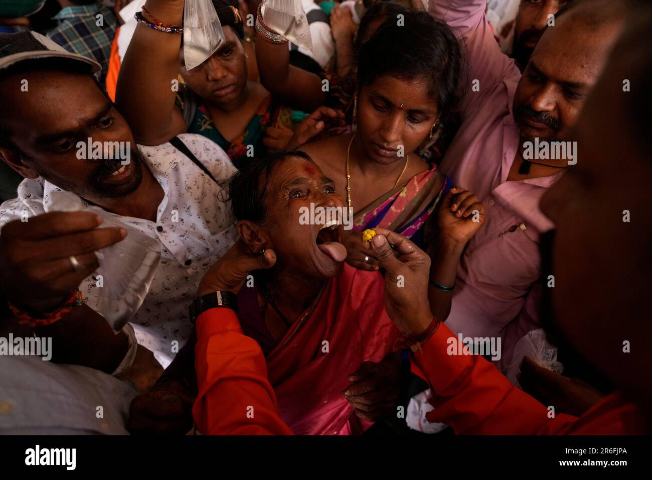 An asthma patient is administered a traditional fish medicine in ...