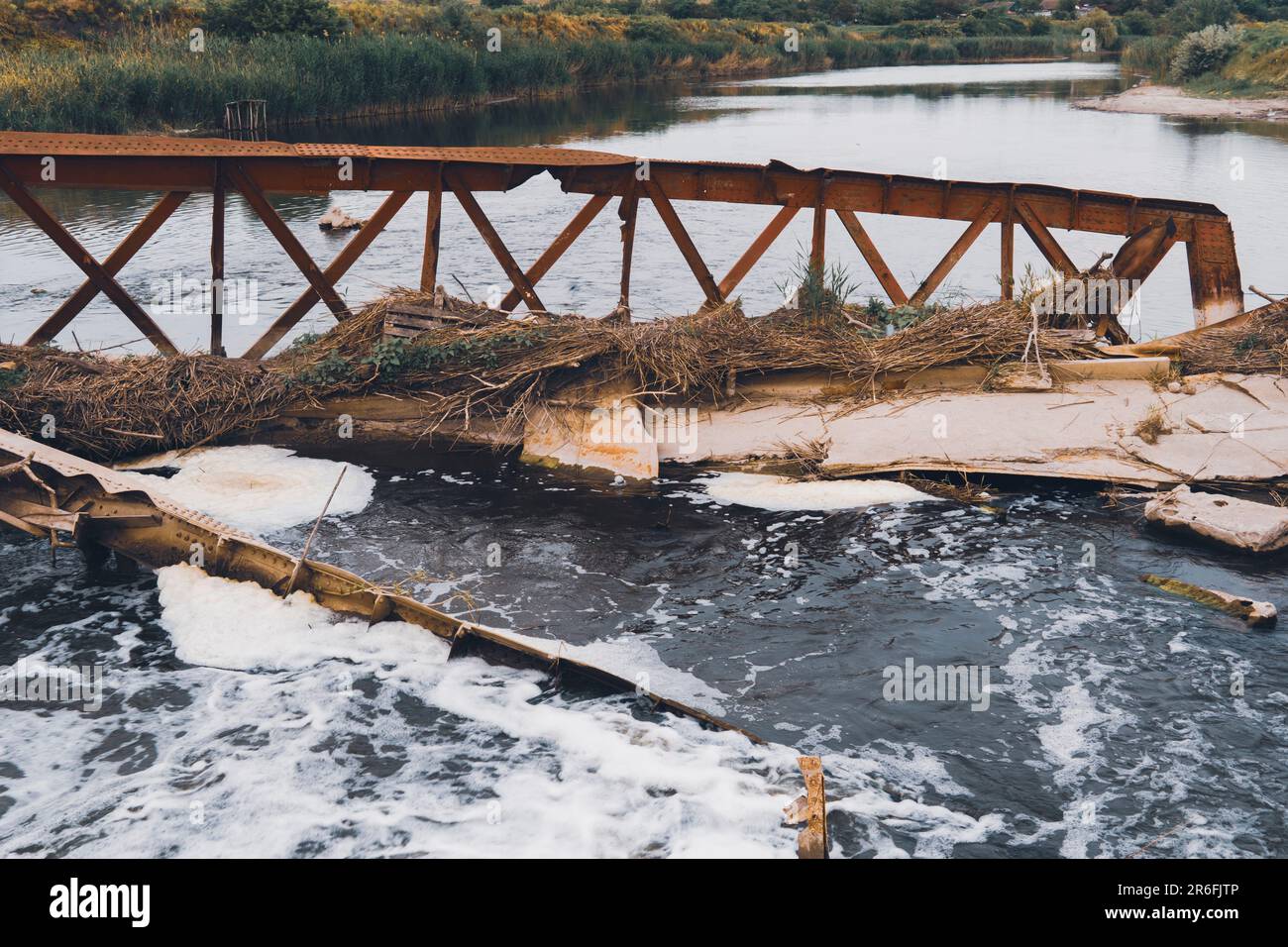 Bridge on the river, destroyed by the water flow. Catastrophe, natural ...