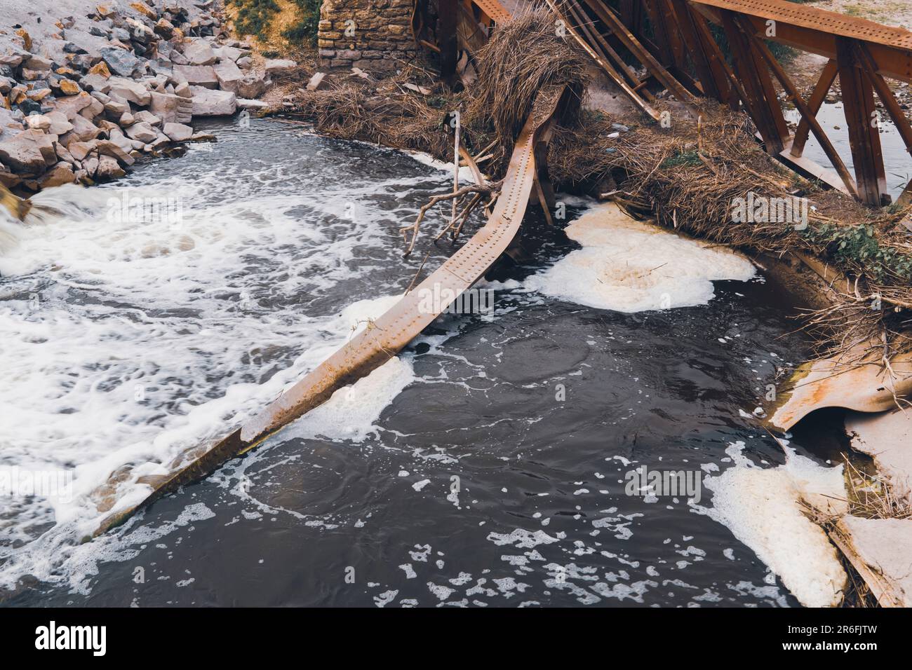 Bridge on the river, destroyed by the water flow. Catastrophe, natural ...