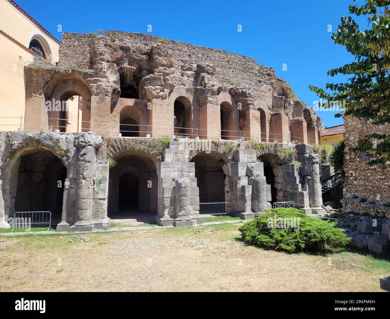 This image shows an ancient stone building featuring several majestic ...