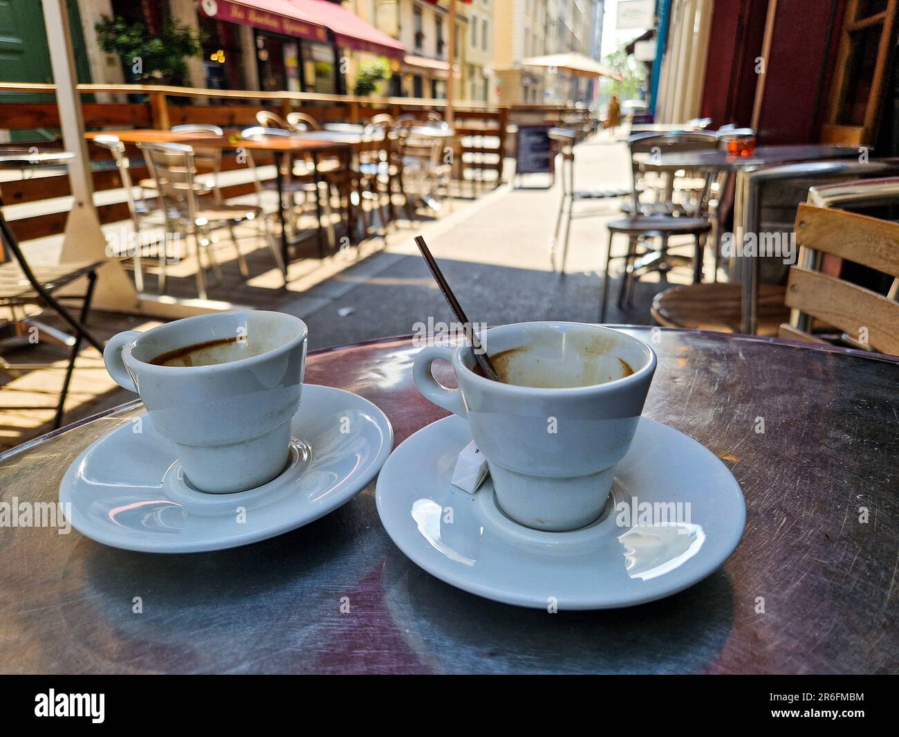 Empty coffee cups, cafe terrace, Lyon, France Stock Photo - Alamy