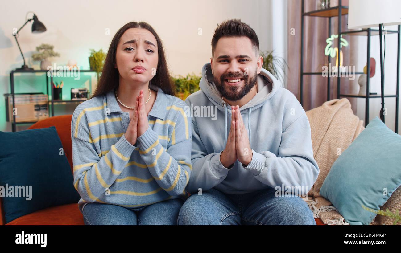 Please, God help. Young family marriage couple man woman praying ...
