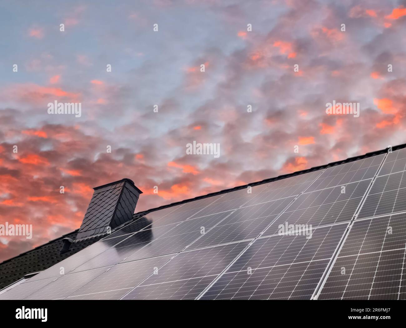 Solar panels producing clean energy on a roof of a residential house ...