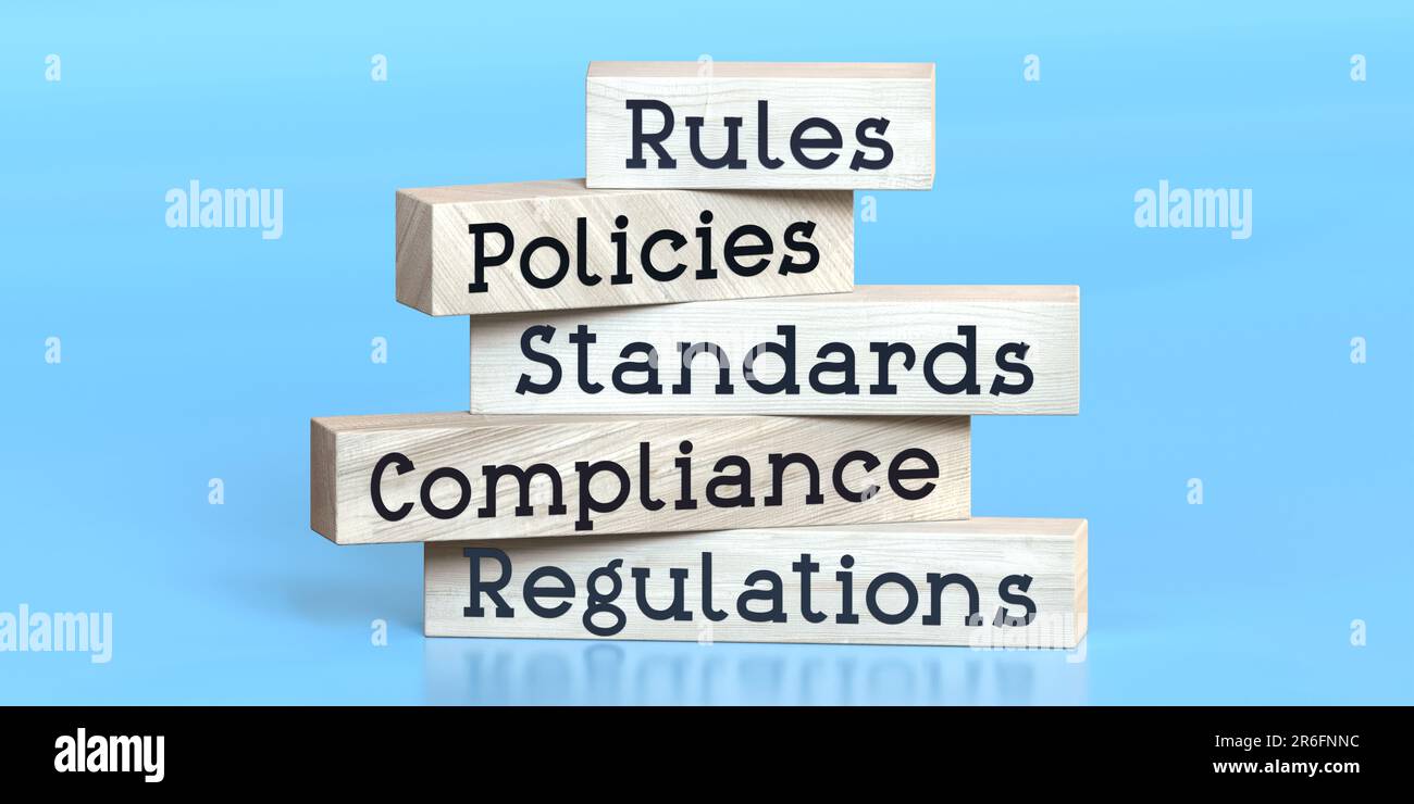 Rules, policies, standards, compliance, regulations - words on wooden ...