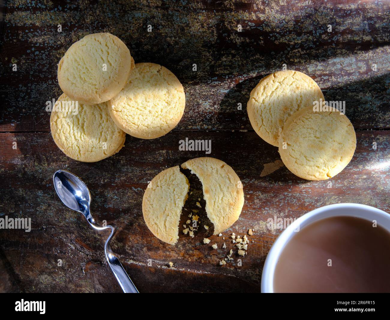 Biscuits Shortbread on table top with crumbs lit by sunlight Stock ...