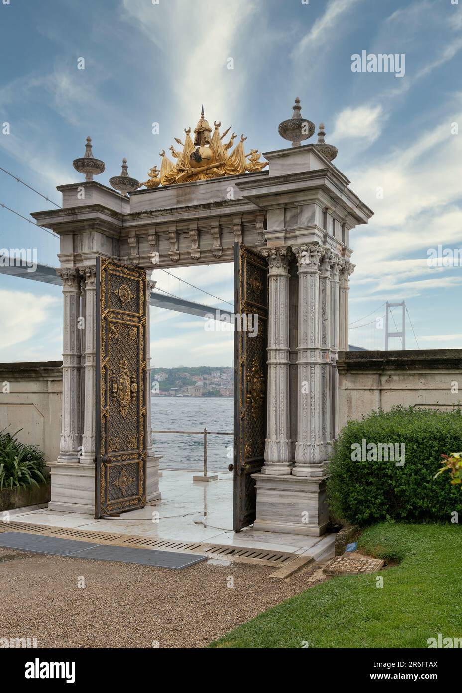 Marble gate with decorated open door leading to the Bosphorus Strait ...