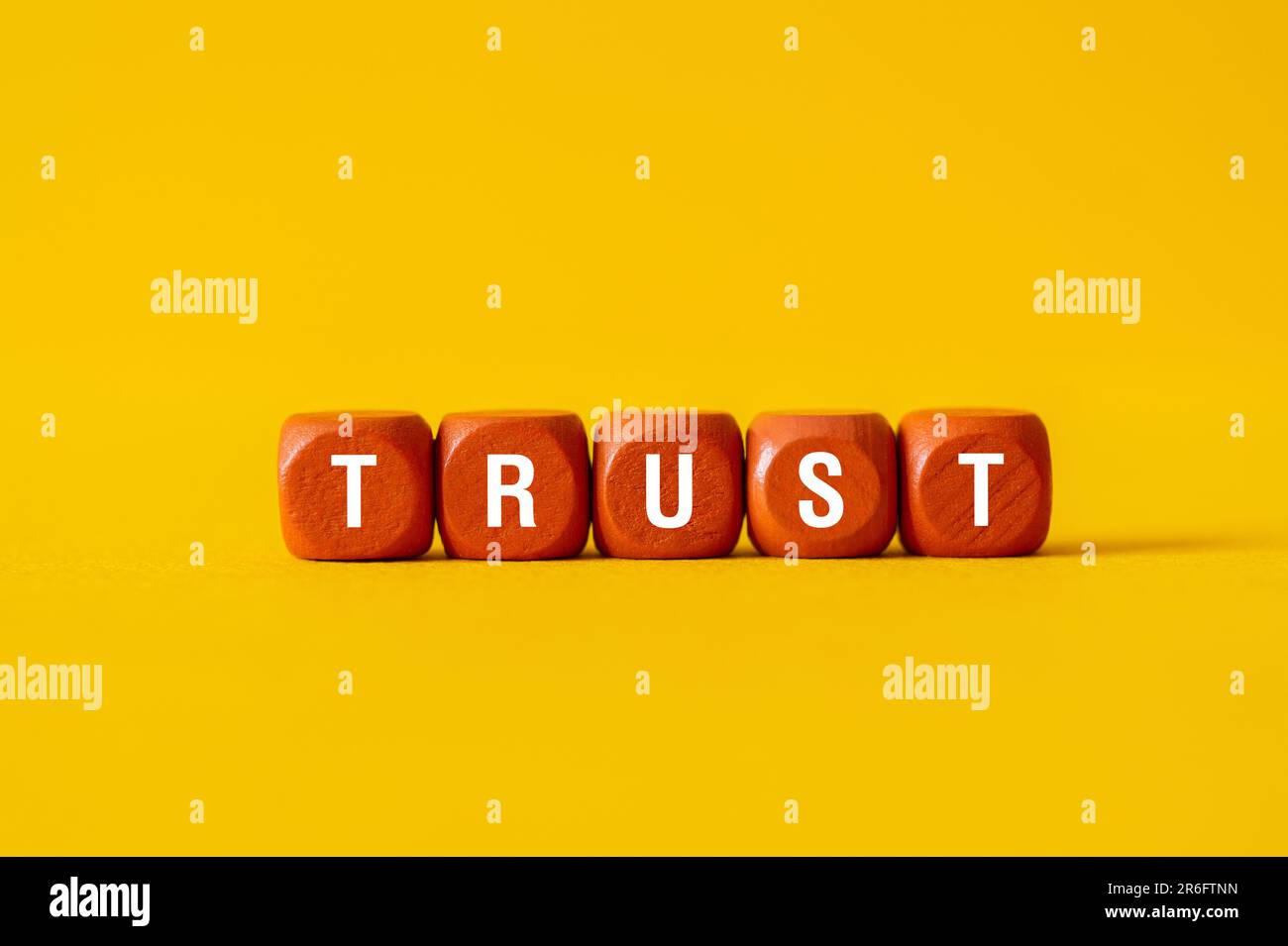 Trust - word concept on building blocks, text, letters Stock Photo - Alamy
