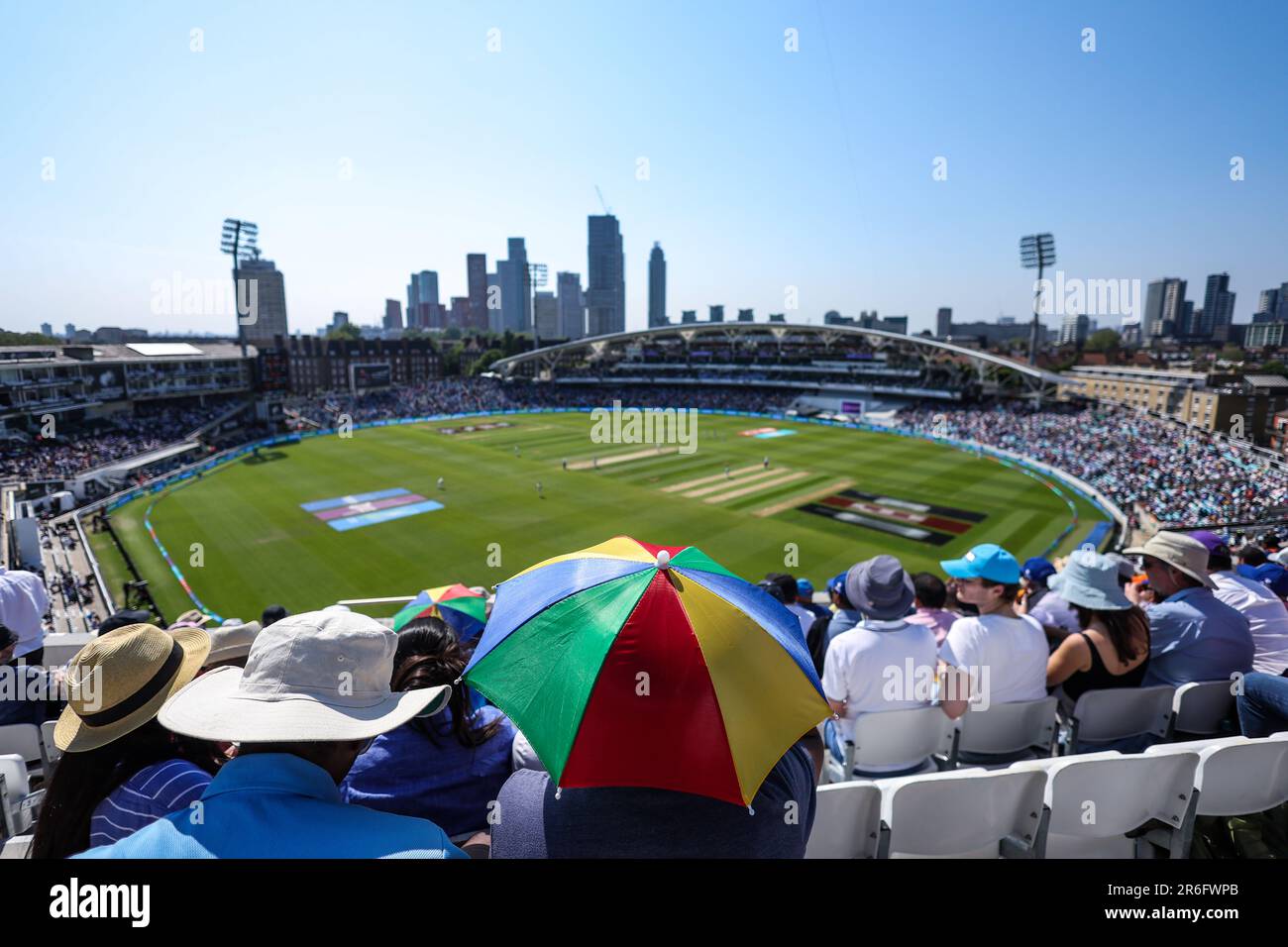General view of a spectator wearing an umbrella hat during day three of ...