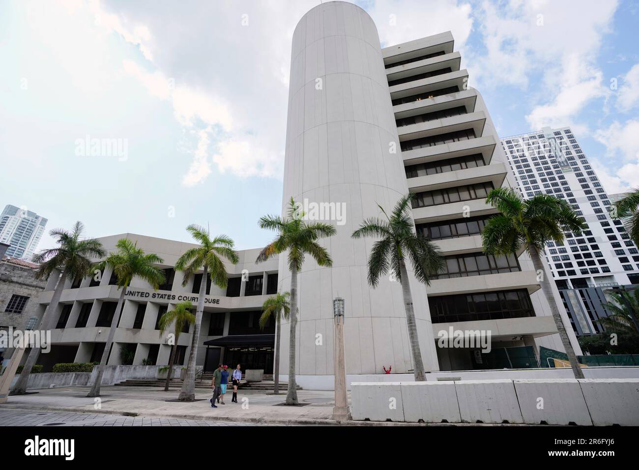 People walk outside the C. Clyde Atkins Federal Courthouse building in ...