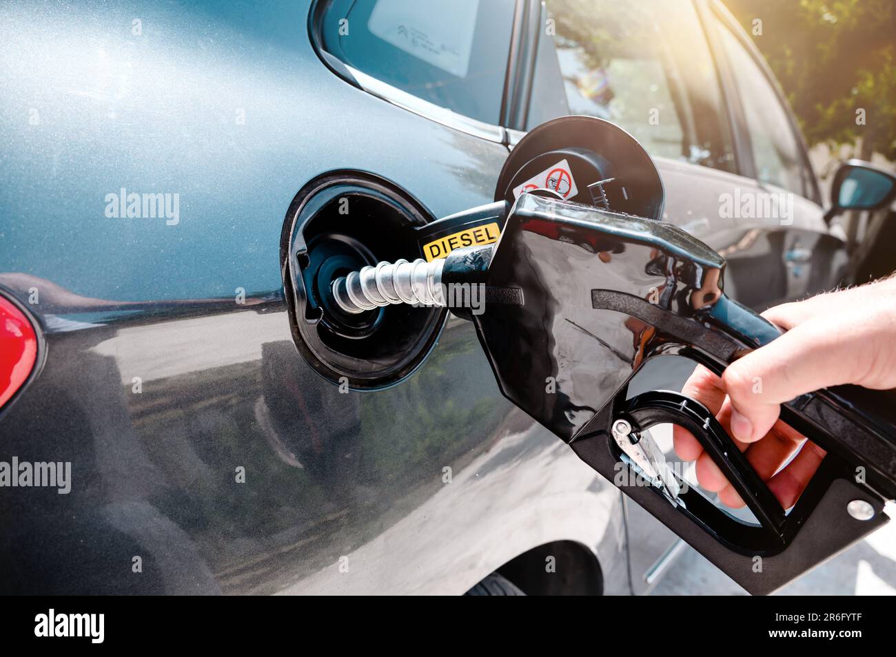 Fuel pump fill a tank of a car in a station Stock Photo - Alamy