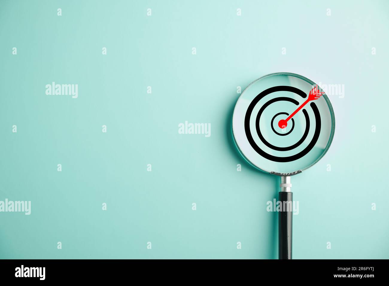 Target board inside magnifier glass for focus business objective Stock ...