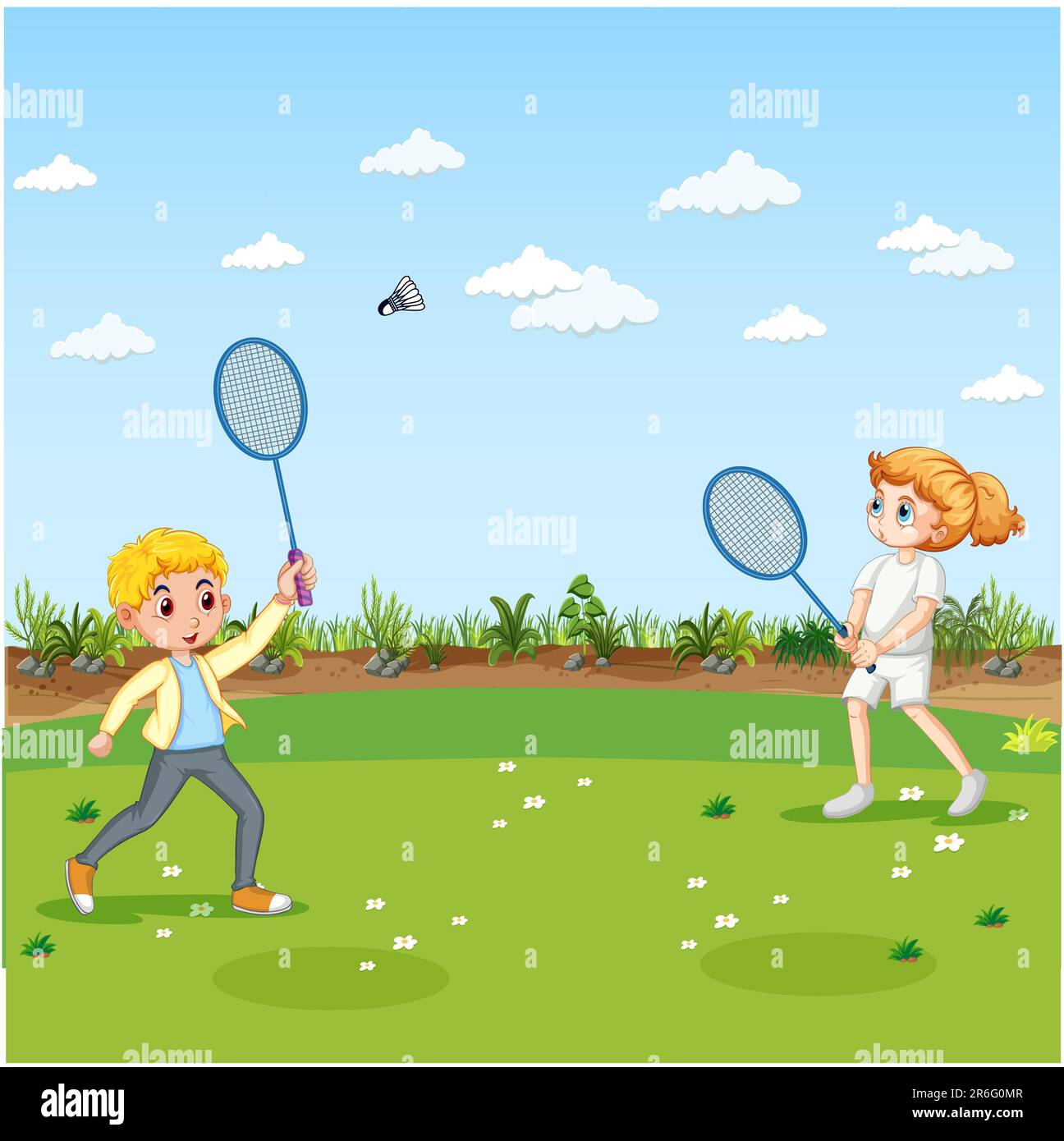 Two children playing the game of badminton on a sunny day in an outdoor ...