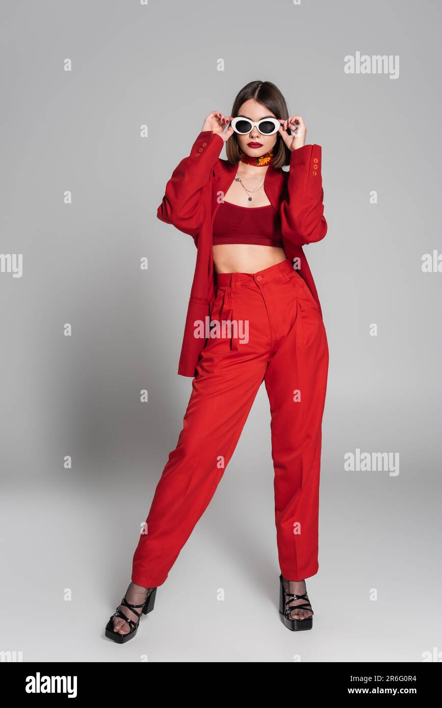 generation z, tattooed young woman with short hair and nose piercing ...