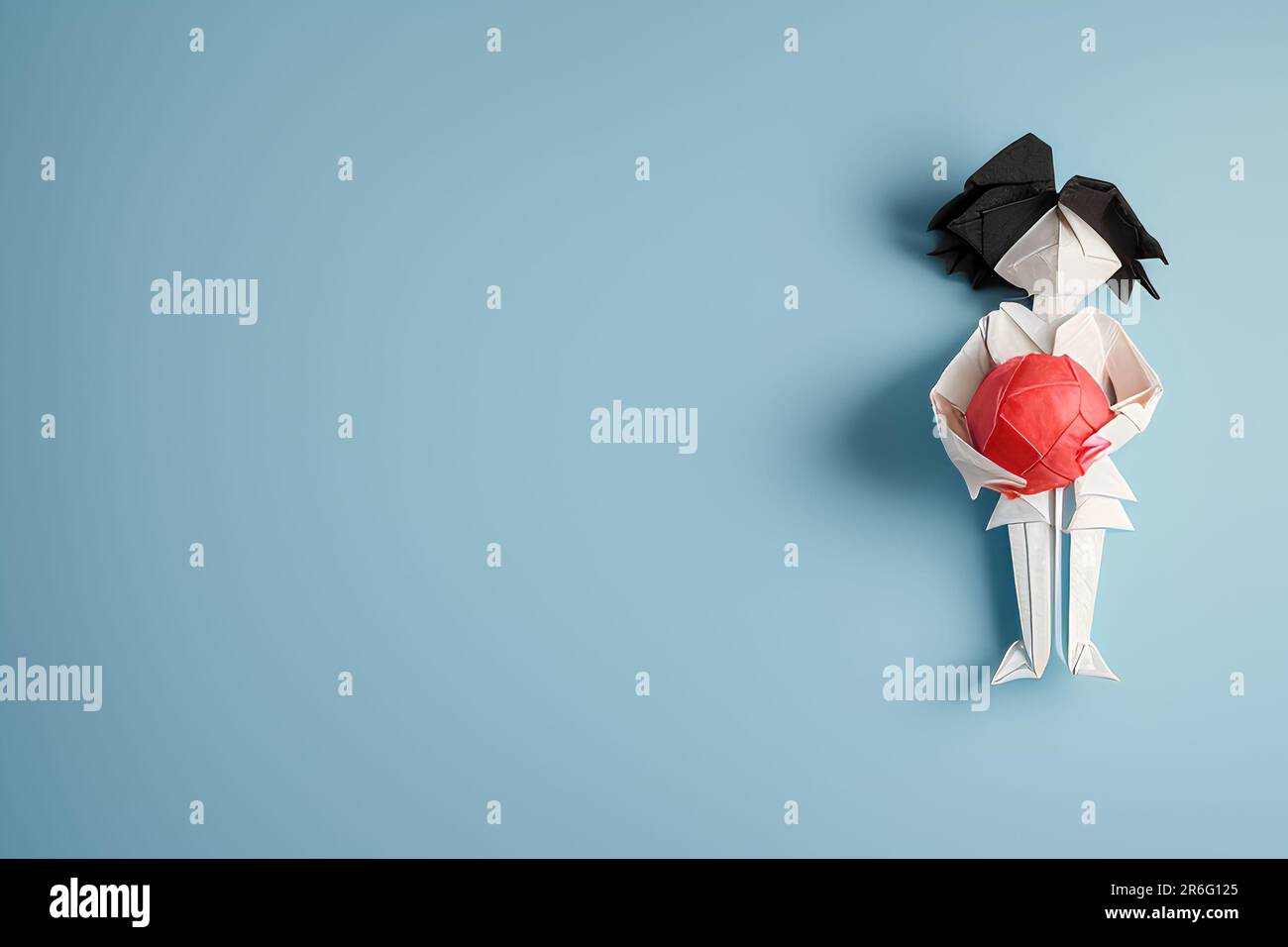 An origami female holding an intricately crafted origami paper ball in ...