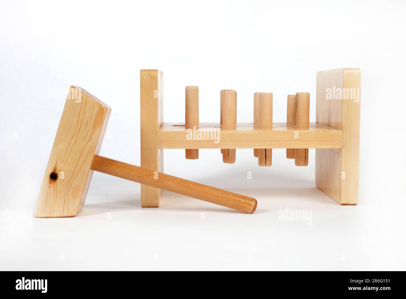A wooden child's hammer and peg toy Stock Photo - Alamy
