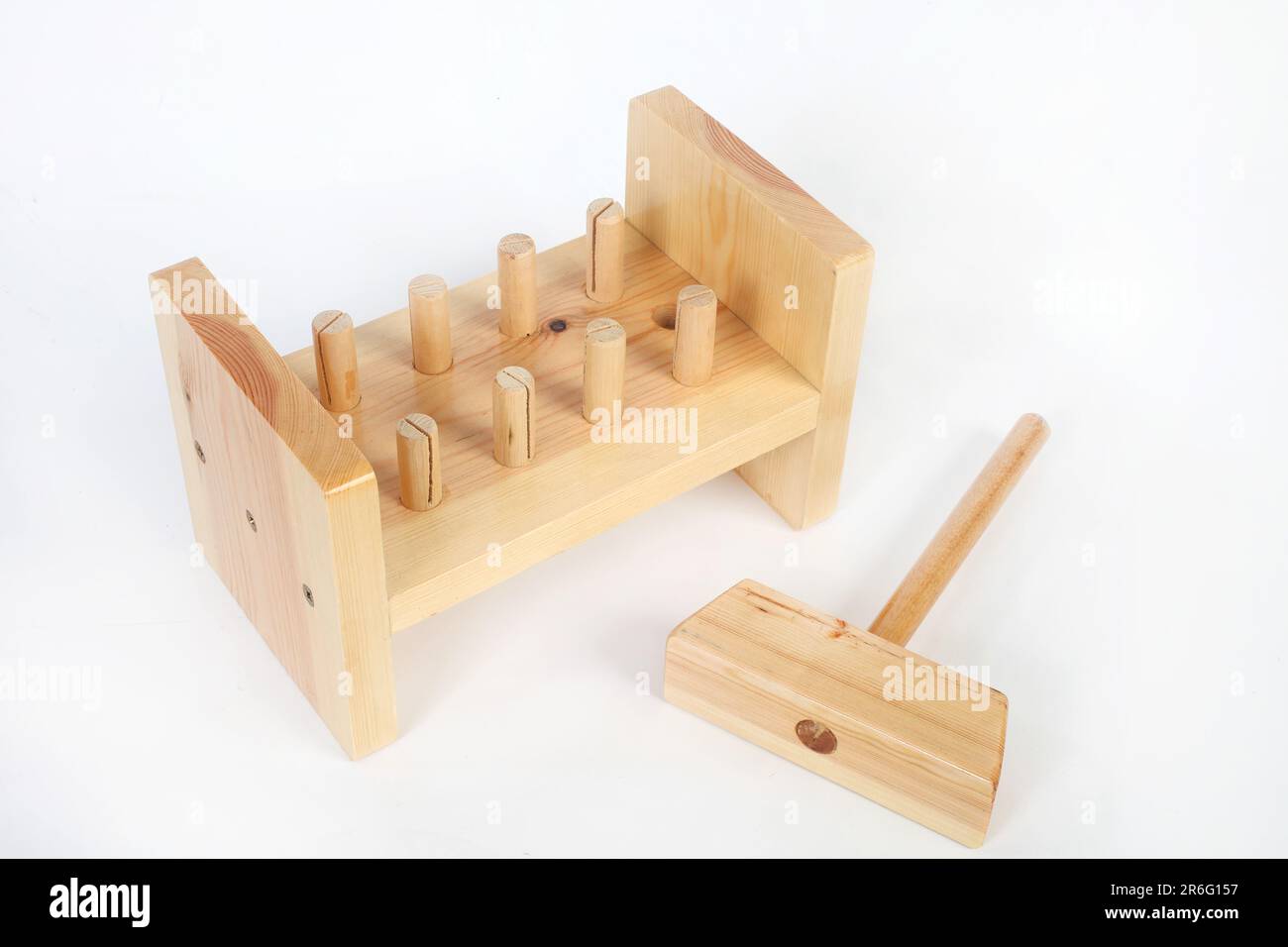 A wooden child's hammer and peg toy Stock Photo - Alamy