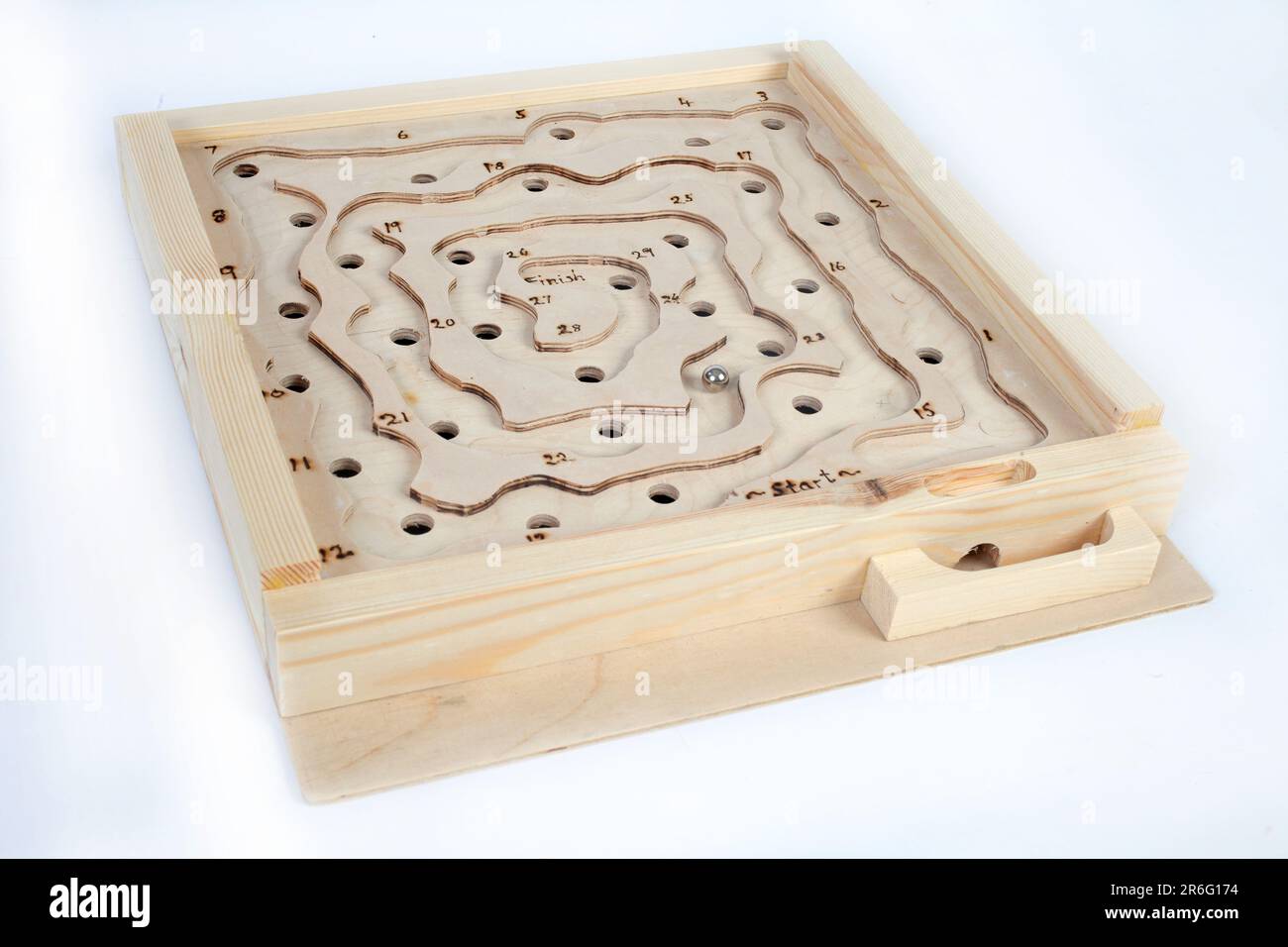 A home-made wooden labyrinth toy Stock Photo - Alamy