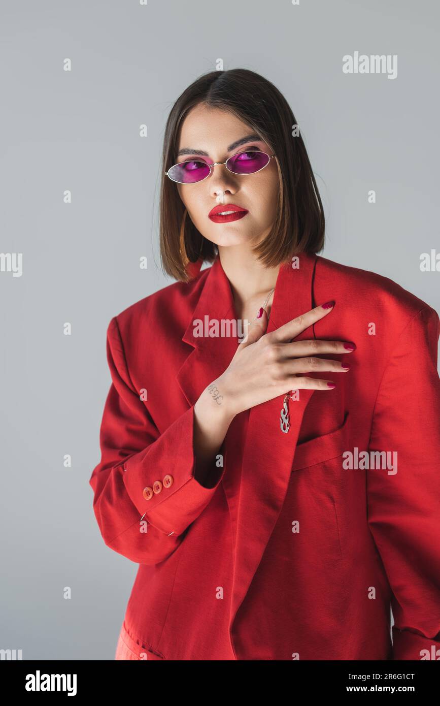 contemporary fashion, young brunette woman with short hair posing in ...