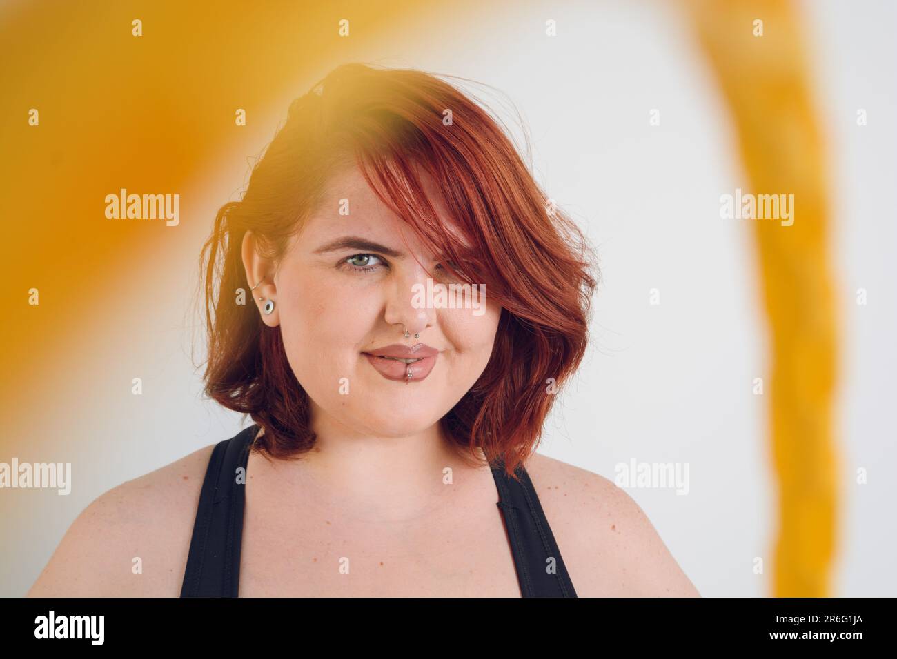 closeup portrait of young plus size argentinian latina woman with green ...