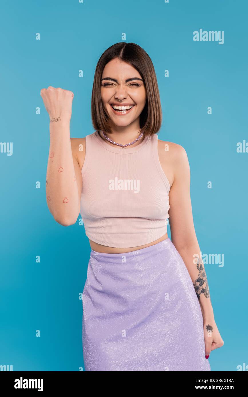 summer trends, positive young woman with short hair in tank top and ...