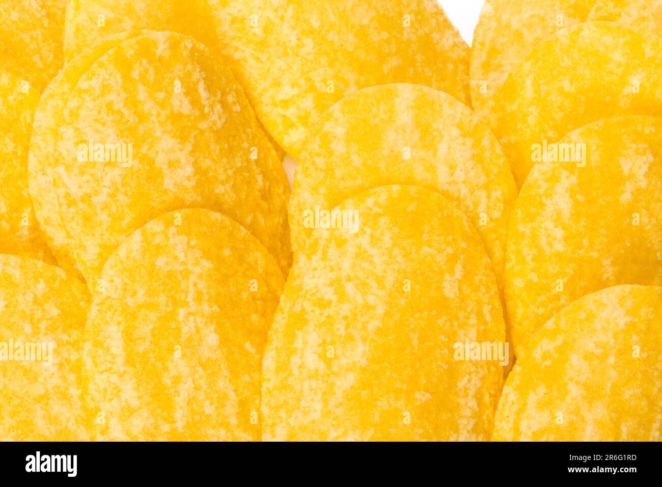 yellow potato chips isolated on white Stock Photo - Alamy