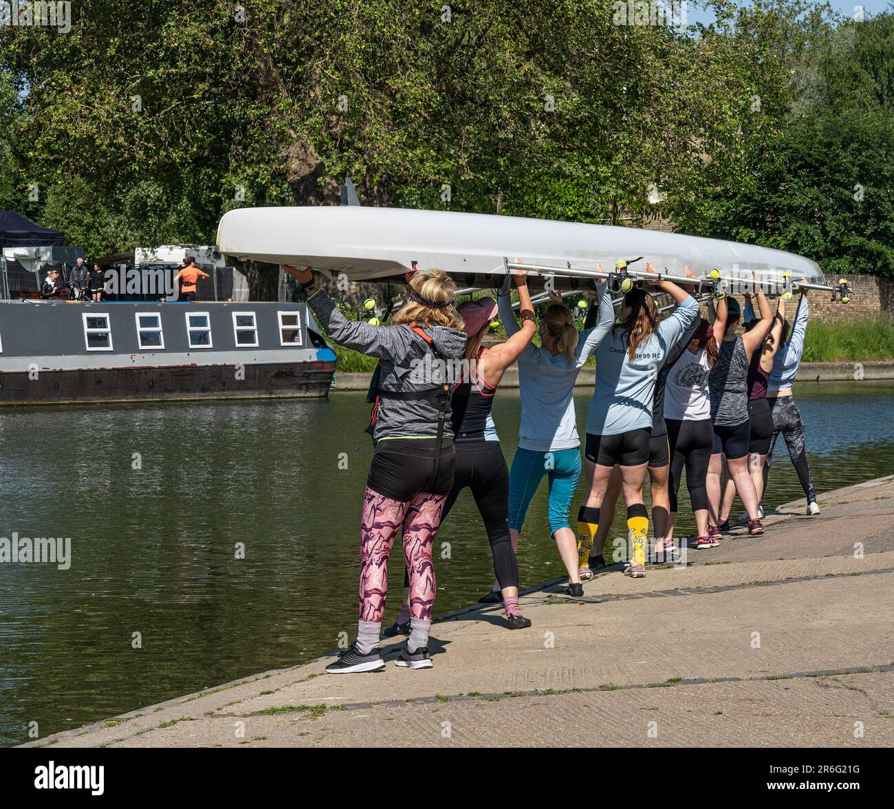 Women putting a rowing boat in the River Cam in Cambridge Stock Photo ...