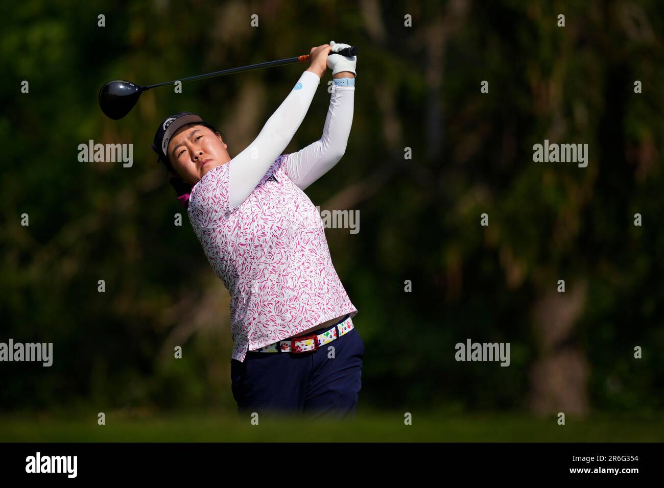 Ruixin Liu, of China, tees off on the 14th hole during the first round ...