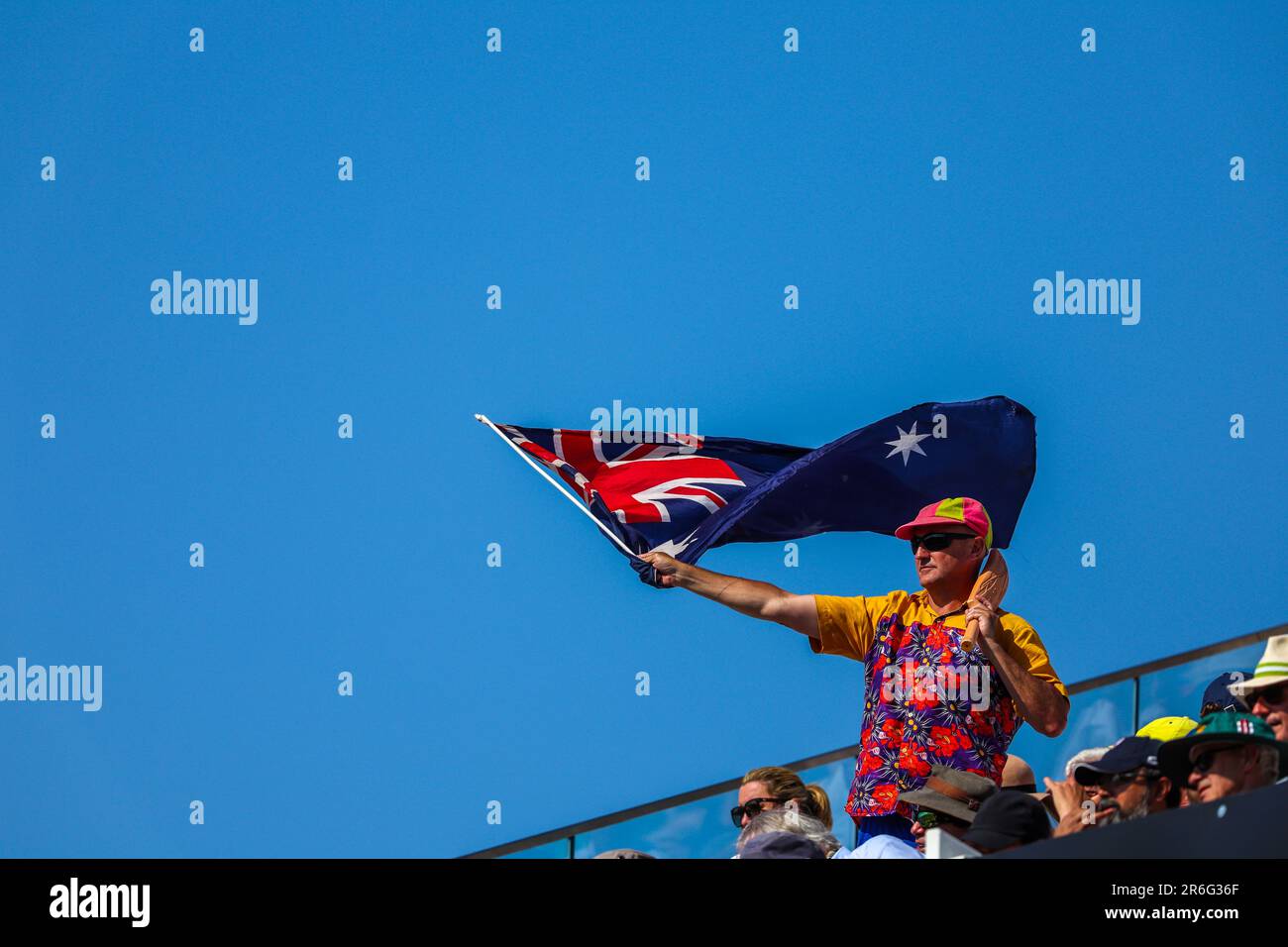 An Australia fan holds up their flag in the stands during day three of ...