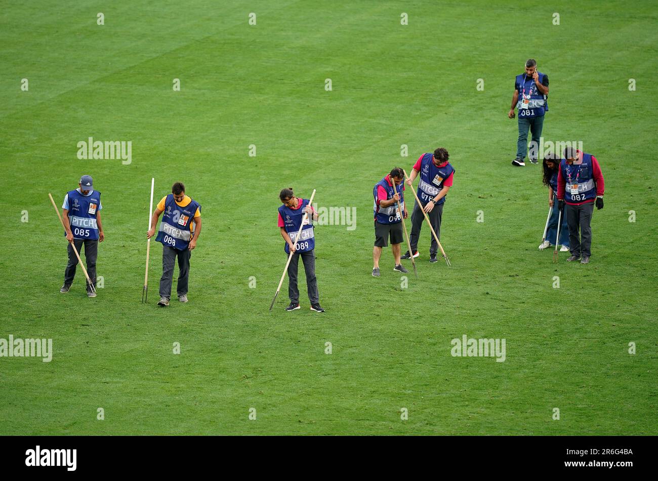 Ground staff tend to the pitch during a training session at the Ataturk ...