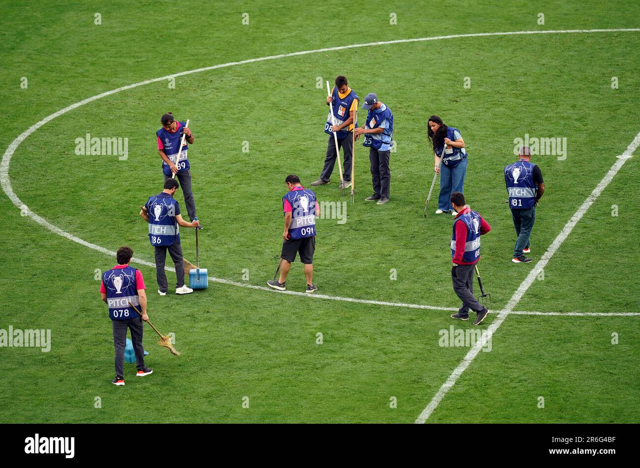Ground staff tend to the pitch during a training session at the Ataturk ...