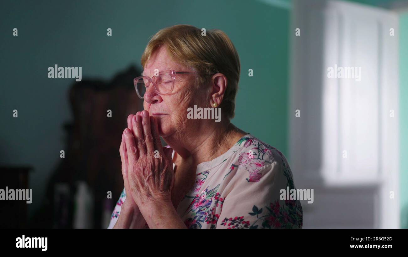 Hopeful Religious Older Woman Praying to God in Bedroom, Feeling ...