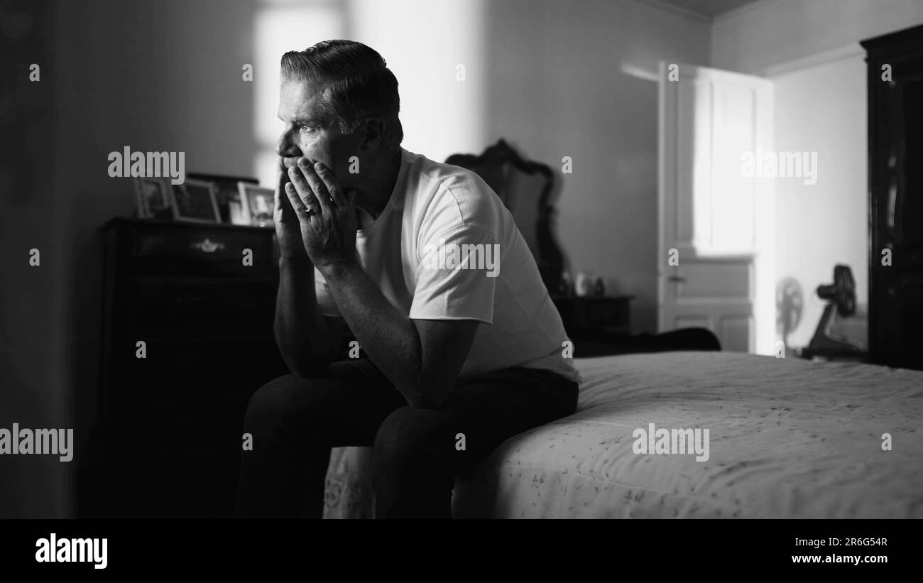 Older man suffering in quiet despair struggling with mental problems in ...
