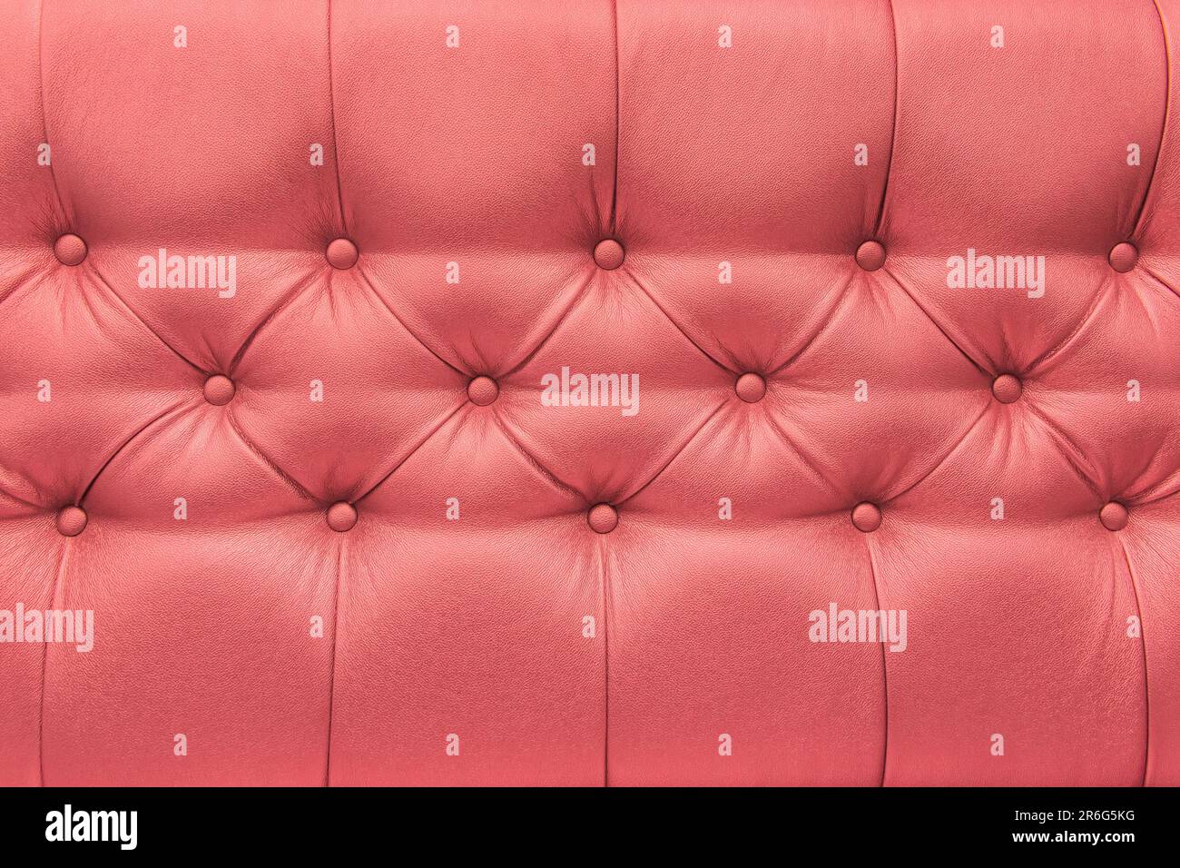 Light red peach colour leather upholstery sofa with pattern button ...