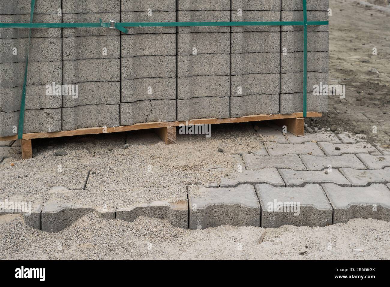 Pallet with gray paving slabs, road repair process, close-up, selective ...
