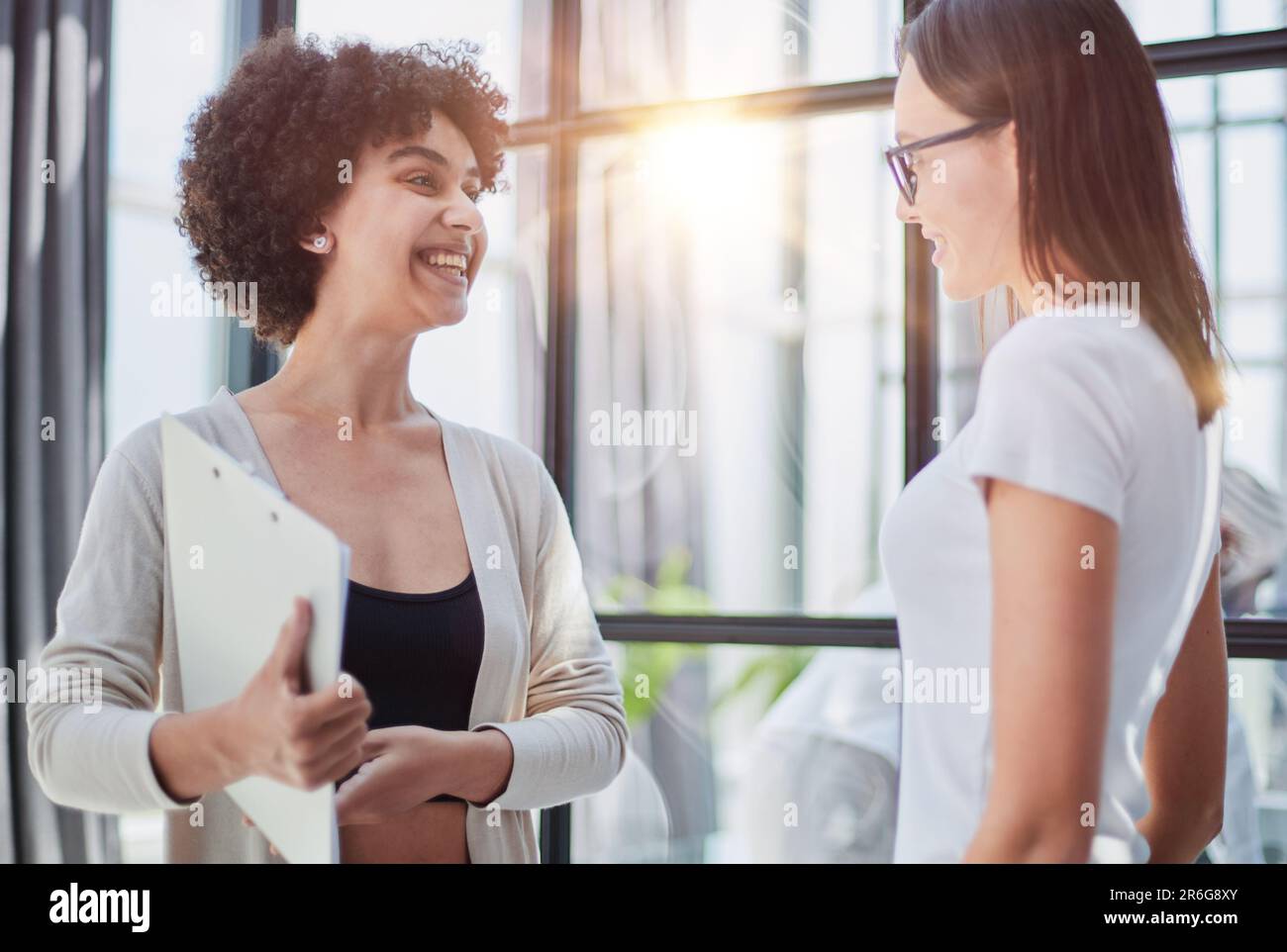 Two middle age beautiful businesswomen smiling happy and confident ...