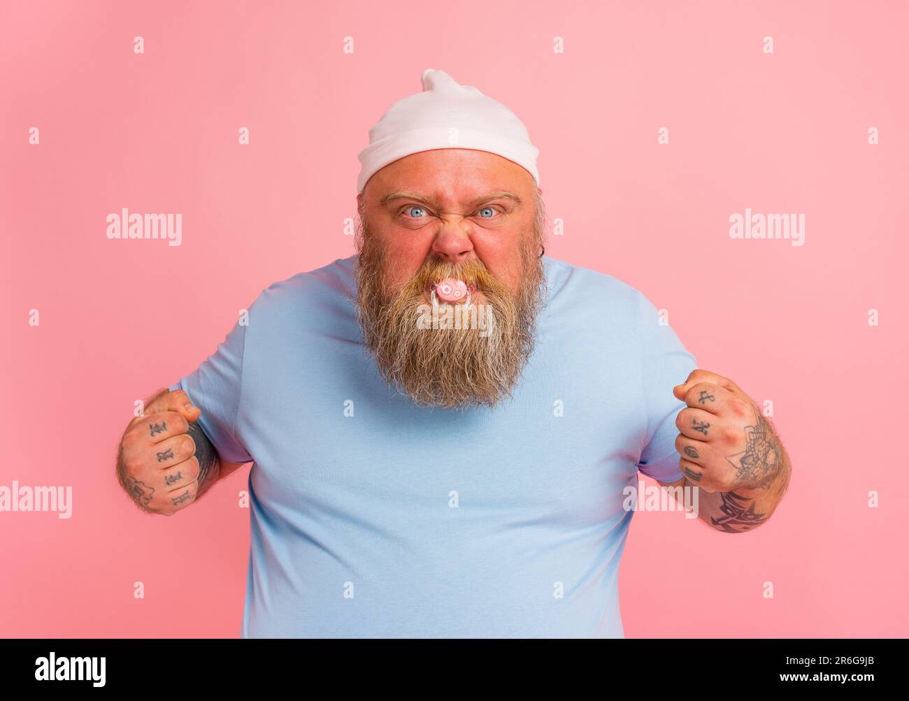 Angry man acts with pacifier like a child a baby Stock Photo - Alamy